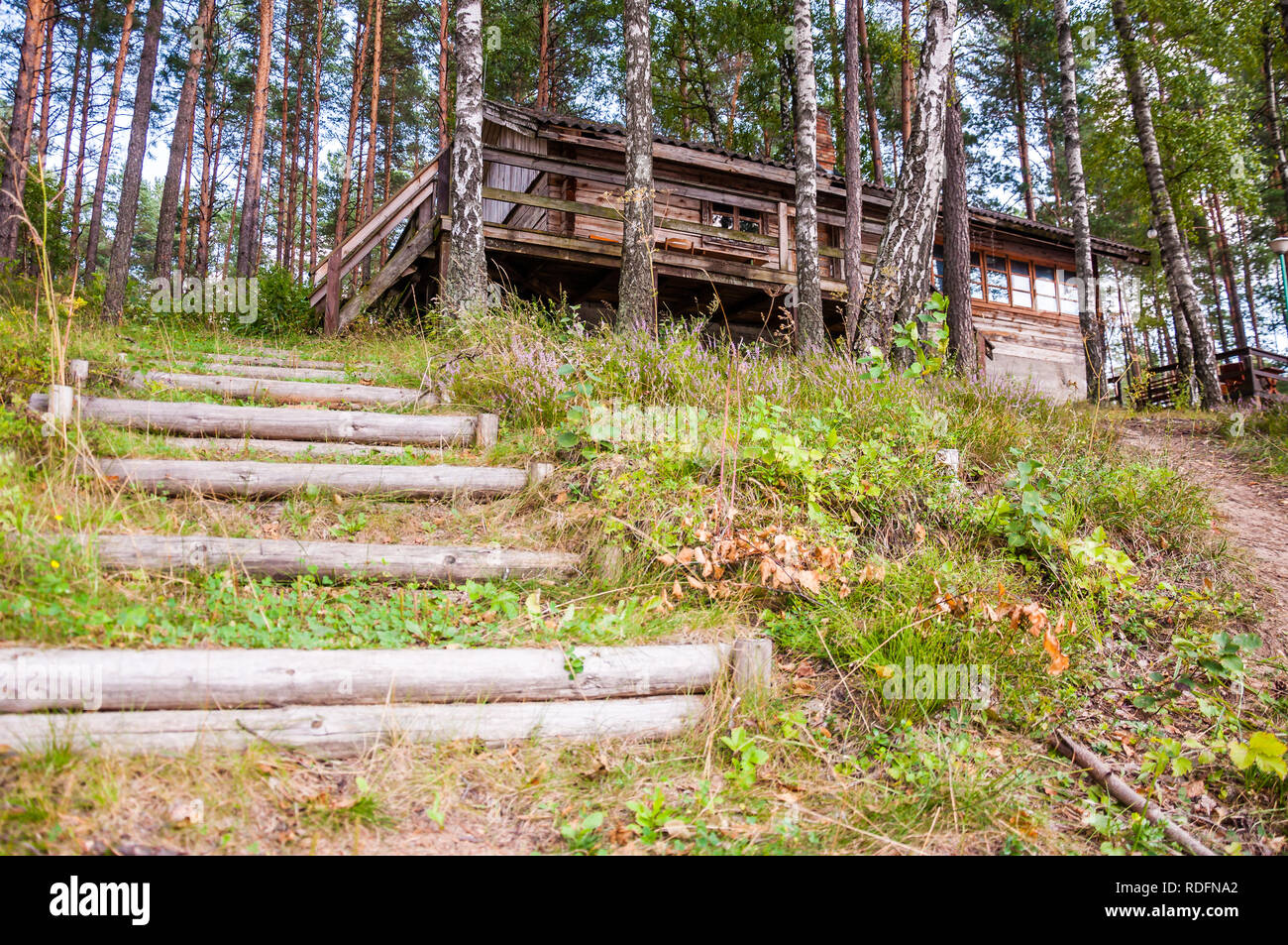 Shabby old traditional wooden forest house with wooden door entrance ...