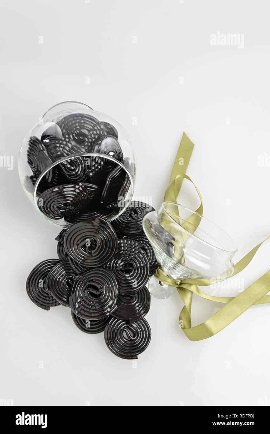 licorice wheels in inverted glass jar from above Stock Photo - Alamy