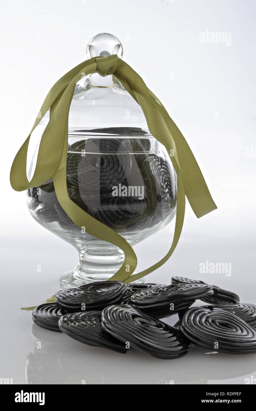 licorice wheels in glass jar with front lid Stock Photo - Alamy