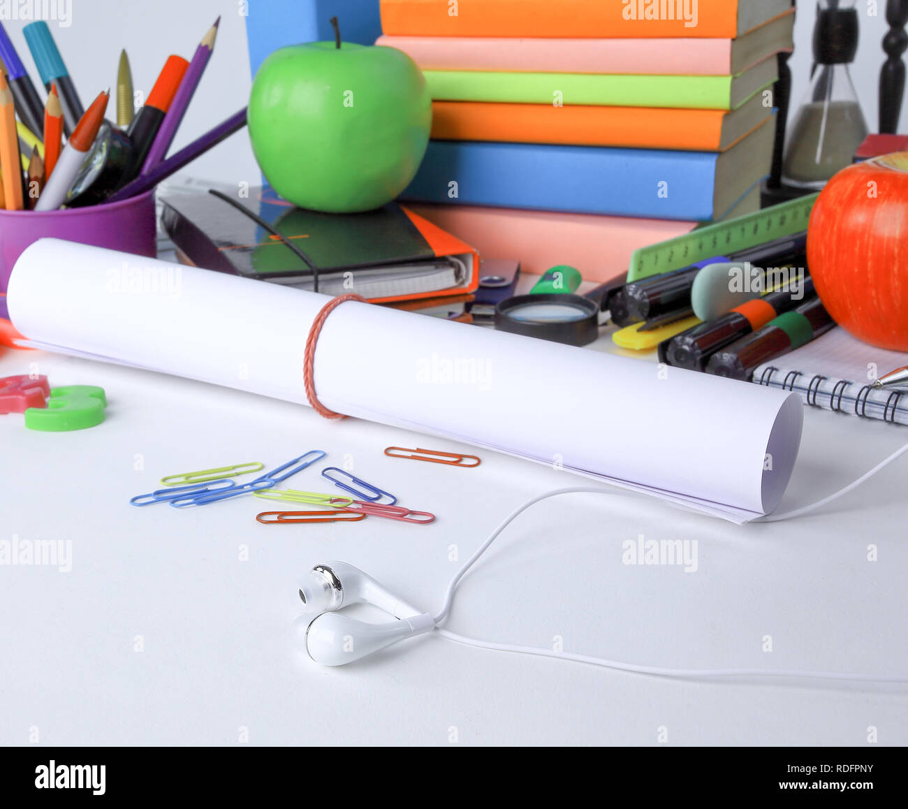 close up.a sheet of drawing paper and school supplies isolated on white ...