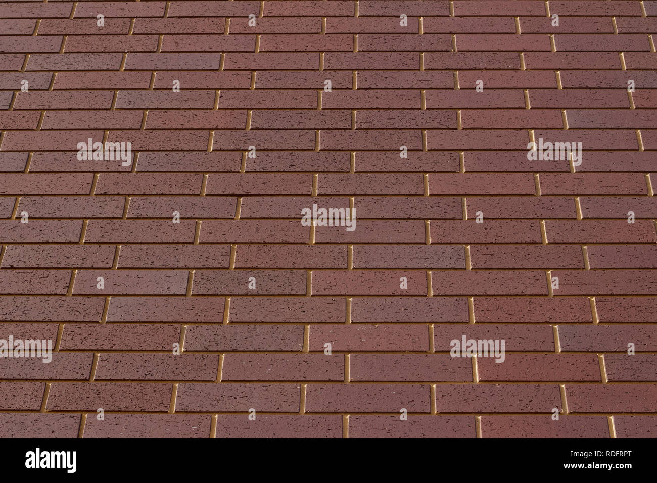 Reddish brown brick wall background with raking stretcher bond ...