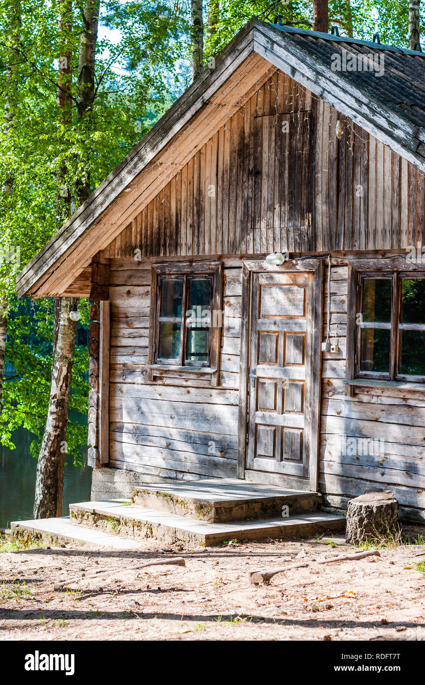 Shabby old traditional wooden forest house with wooden door entrance ...