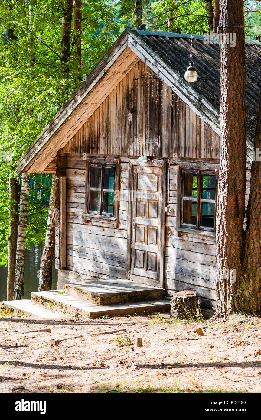 Shabby old traditional wooden forest house with wooden door entrance ...