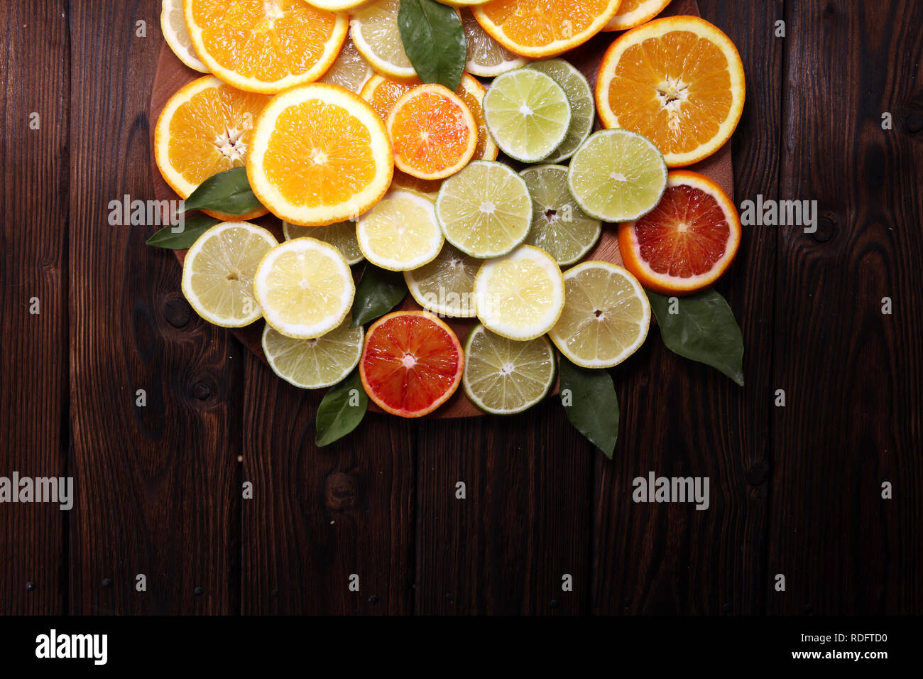 Citrus fruits with orange, lemon, grapefruit and lime on brown ...
