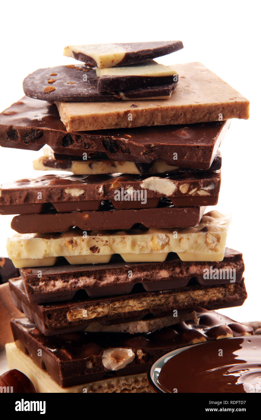 Chocolate bars on table with chocolate tower. Chocolate and nuts and ...