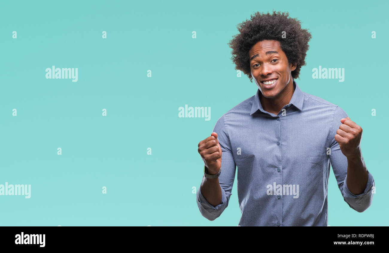Afro american man over isolated background very happy and excited doing ...