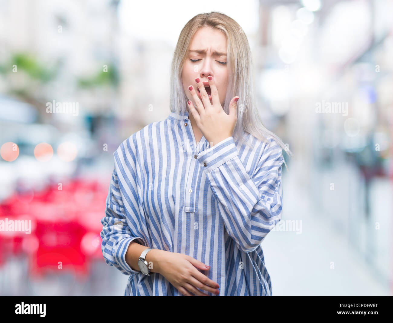 Young blonde woman over isolated background bored yawning tired ...