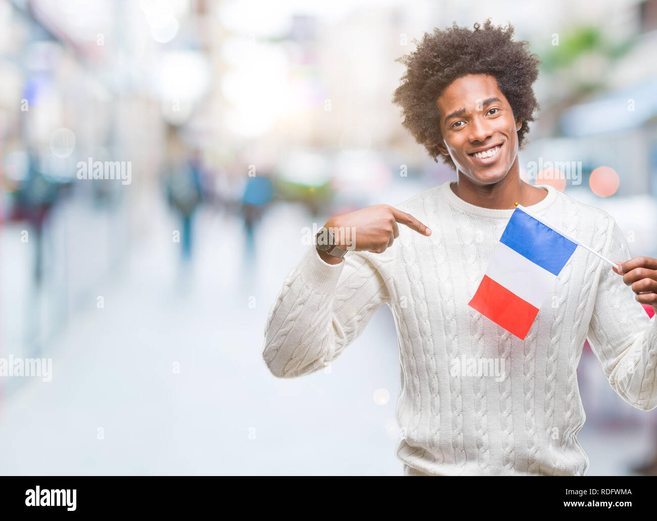 Afro american man flag of France over isolated background with surprise ...