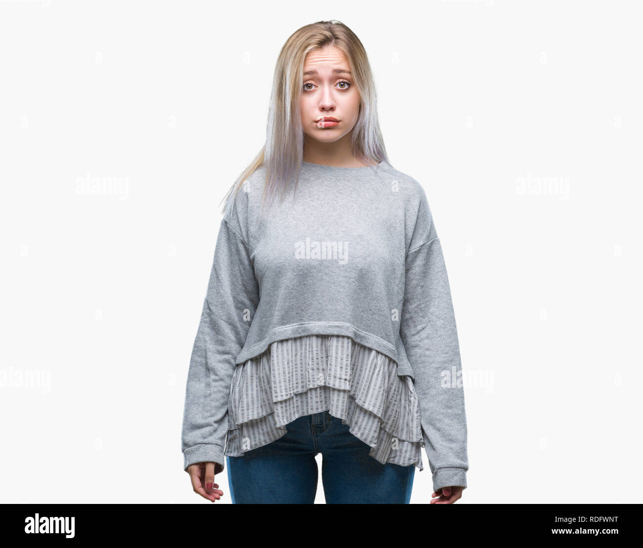 Young blonde woman over isolated background depressed and worry for ...