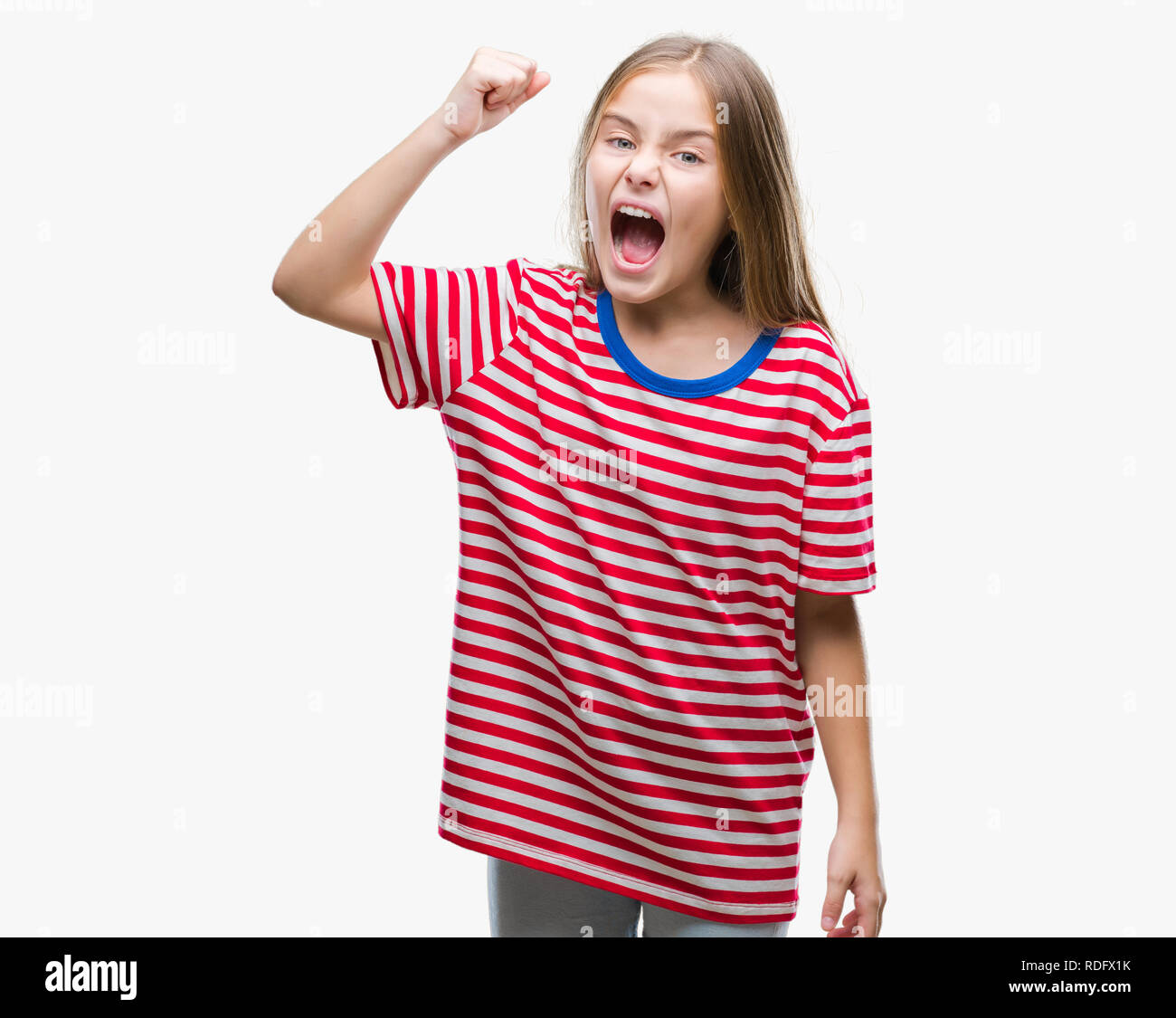 Young beautiful girl over isolated background angry and mad raising ...