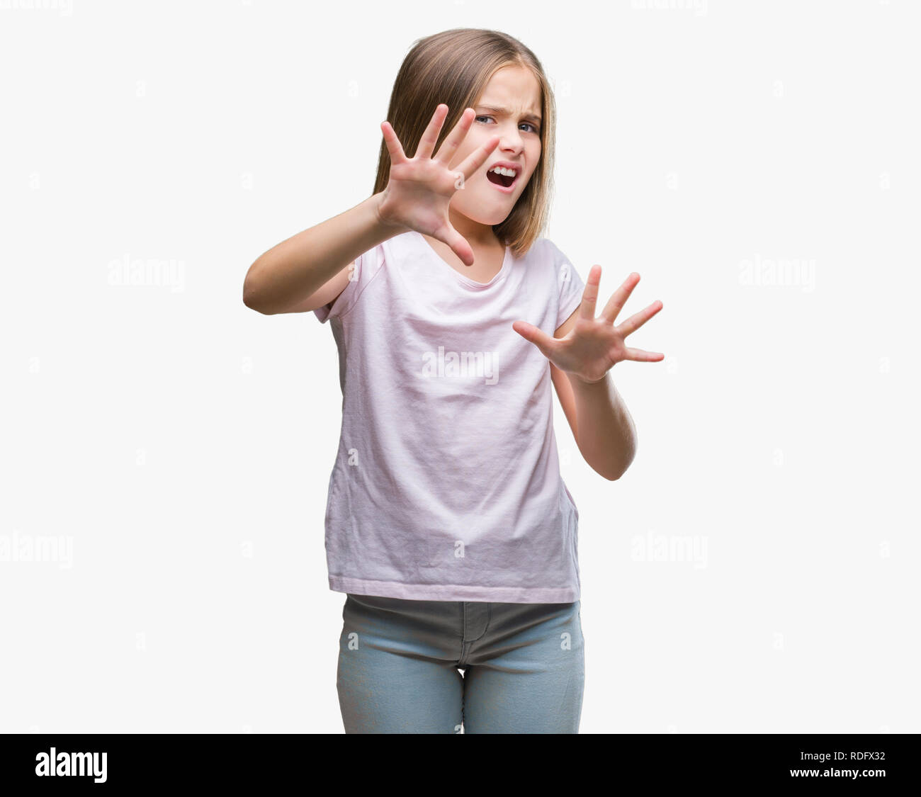 Young beautiful girl over isolated background afraid and terrified with ...