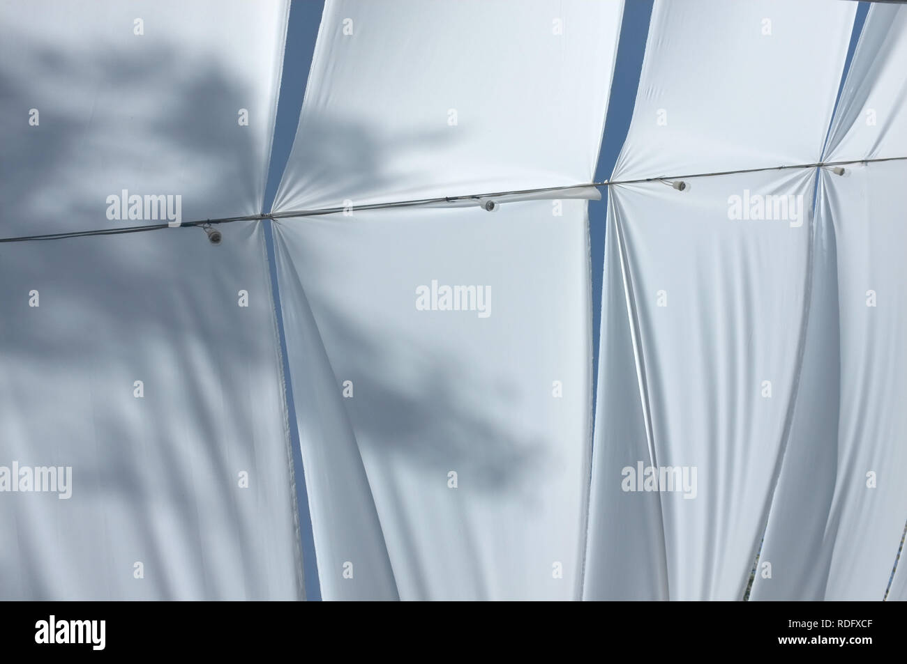 Awning over blue sky. Sky and clouds view from underneath between white ...