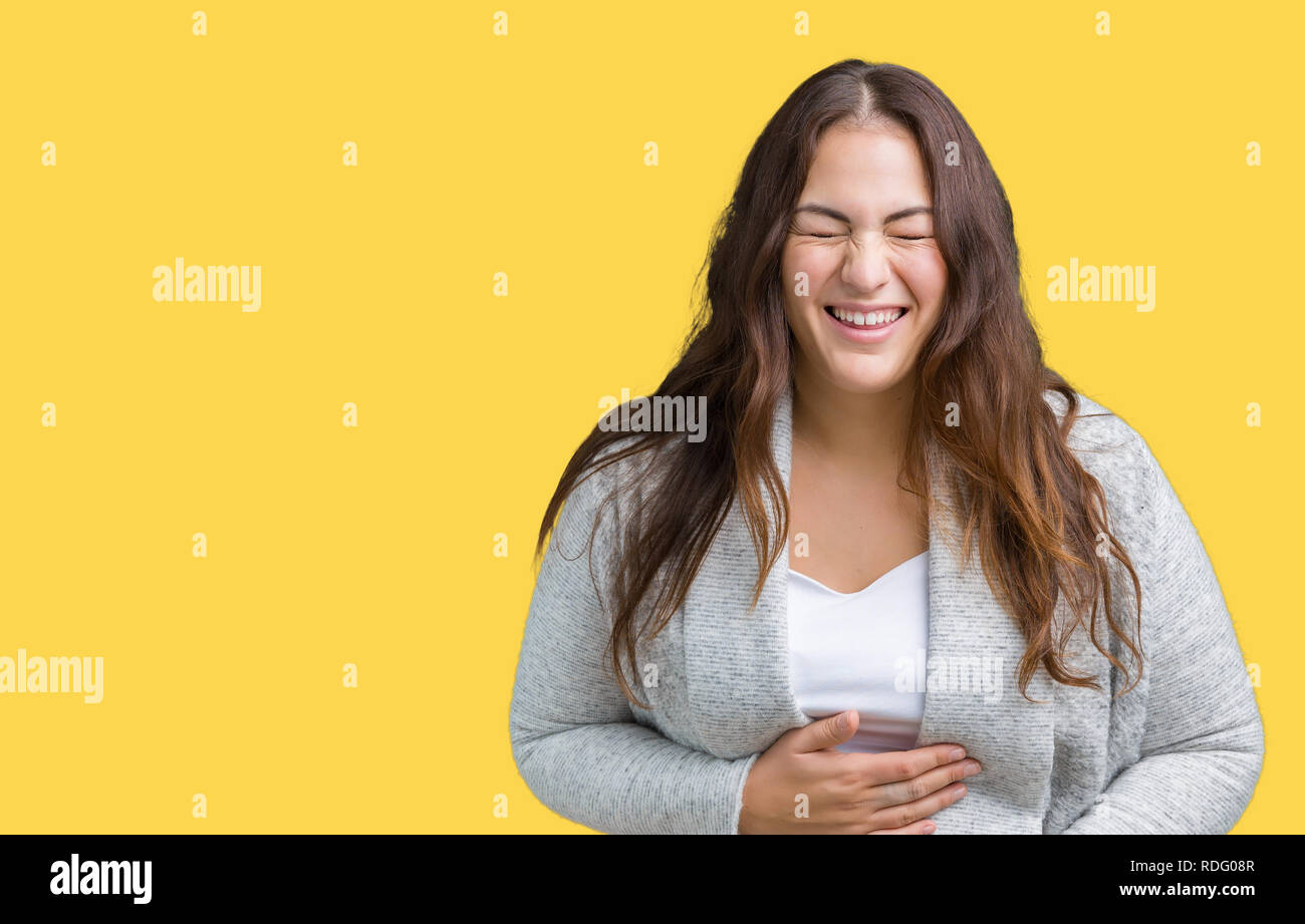 Beautiful plus size young woman wearing winter jacket over isolated ...