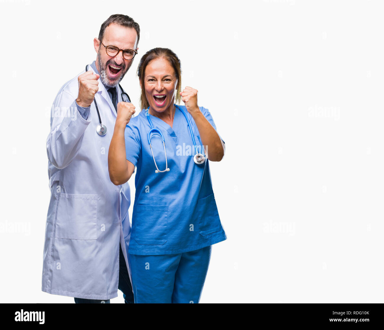 Middle age hispanic doctors partners couple wearing medical uniform ...