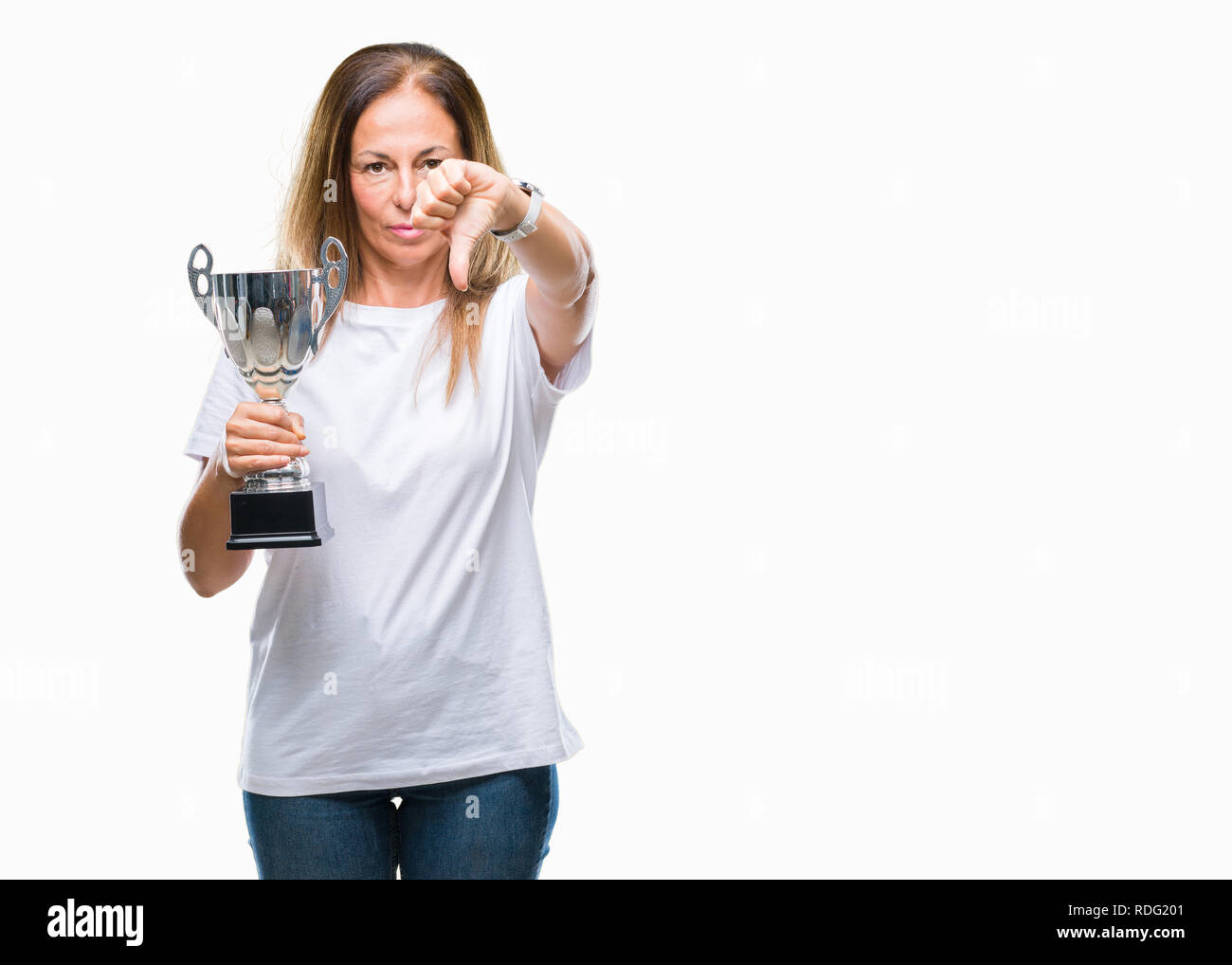 Middle age hispanic winner woman celebrating award holding trophy over ...