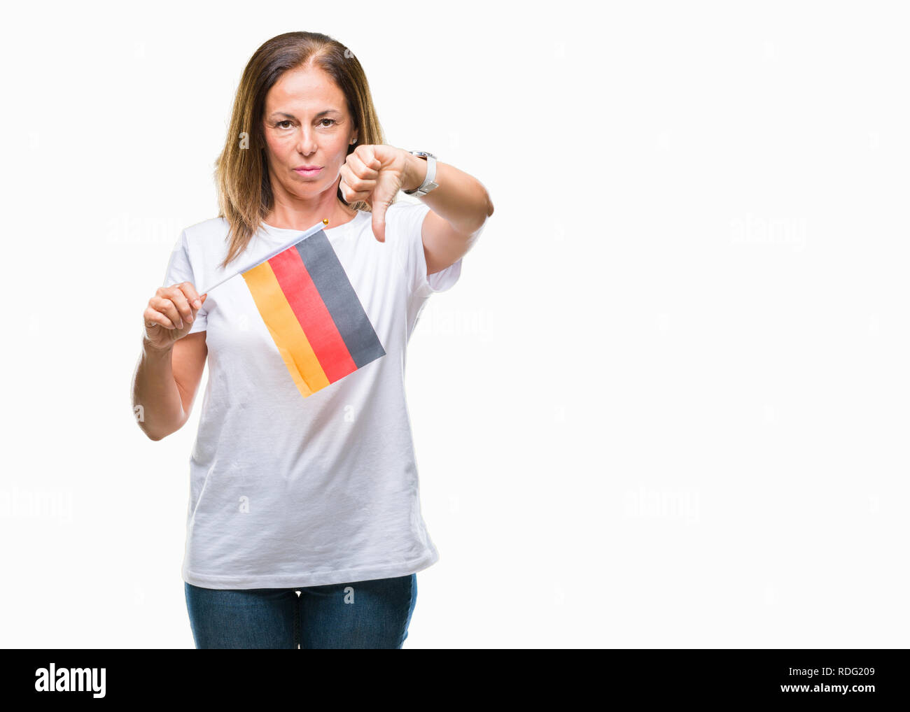 Middle age hispanic woman holding flag of Germany over isolated ...
