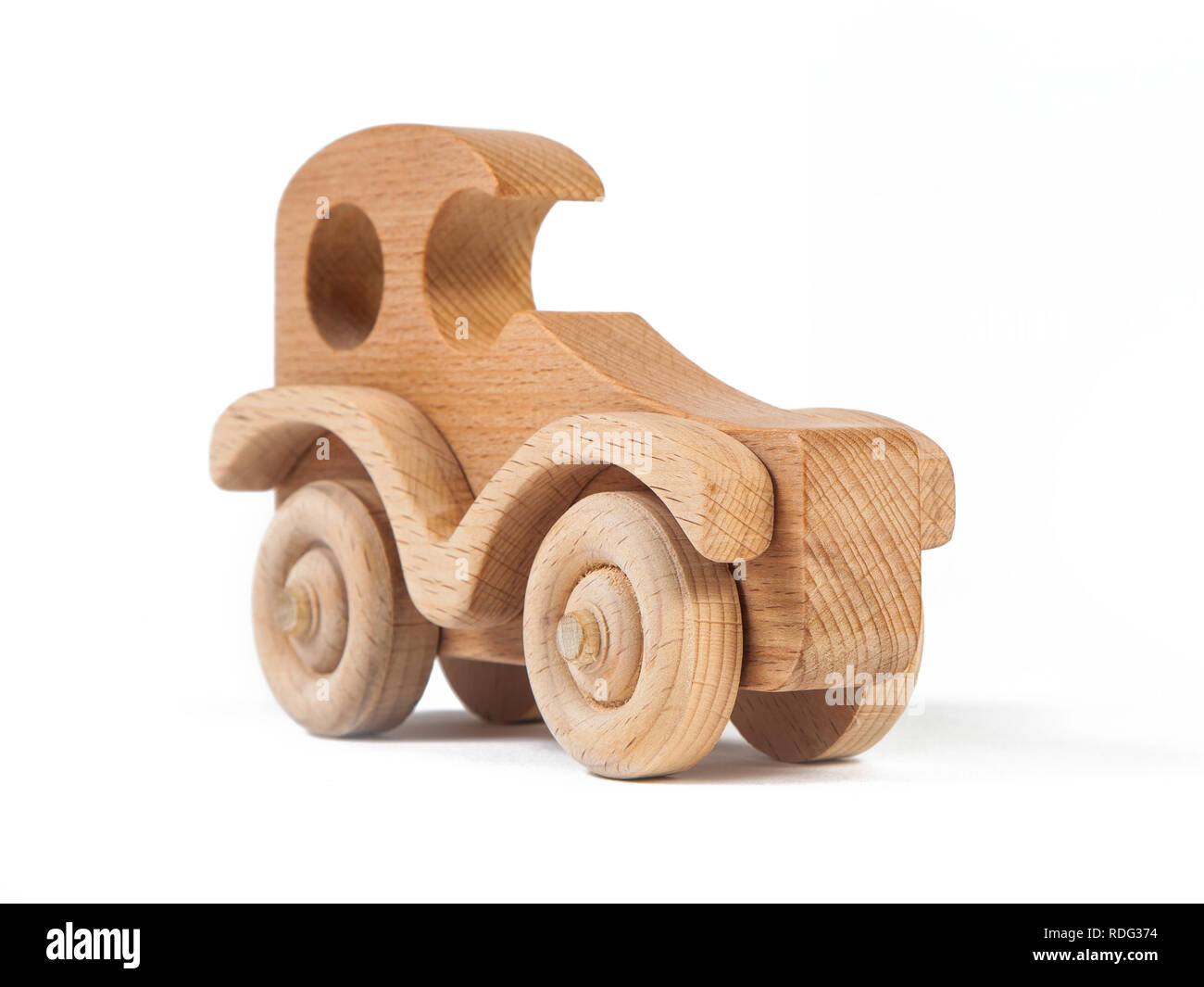 Photo of a wooden car of beech. Toy made of wood retro car on a white ...
