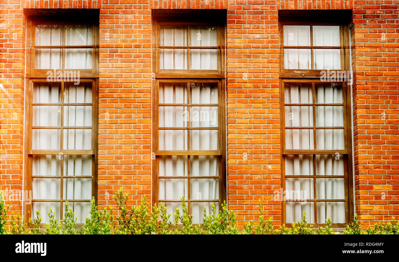 The Red window brown wood wall.Detail of colorful window on old ...