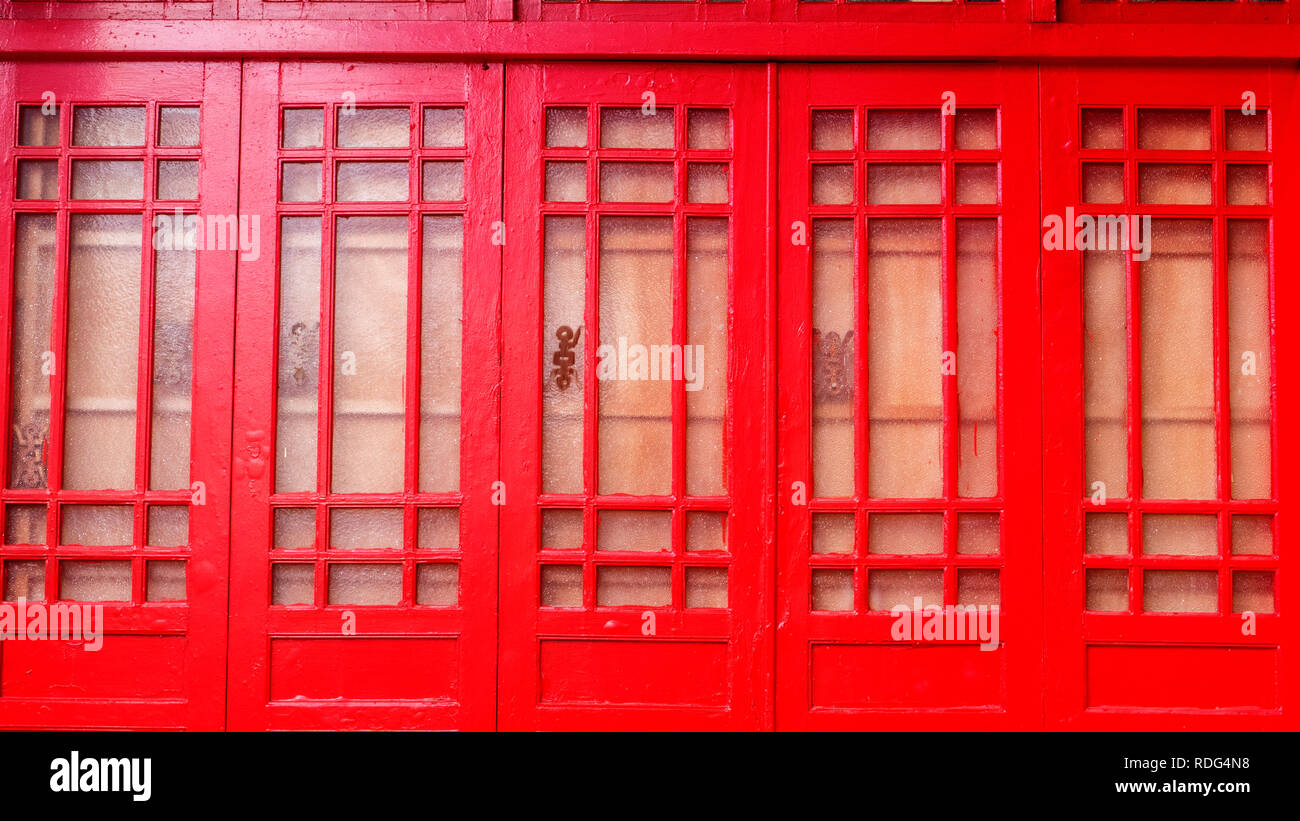 The Red window brown wood wall.Detail of colorful window on old ...