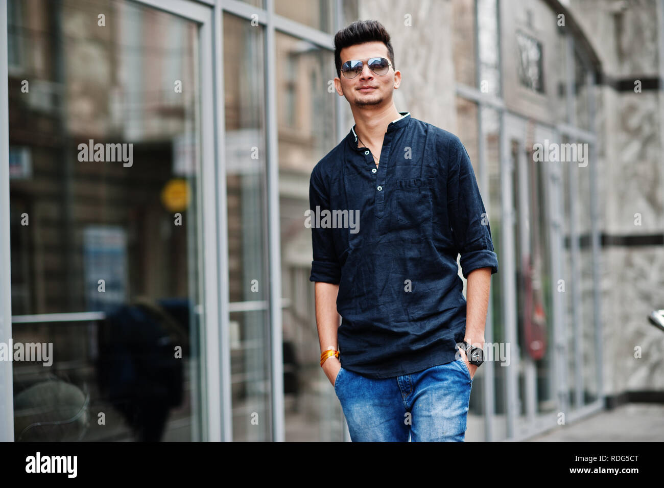Stylish indian model man in casual clothes and sunglasses posed outdoor ...