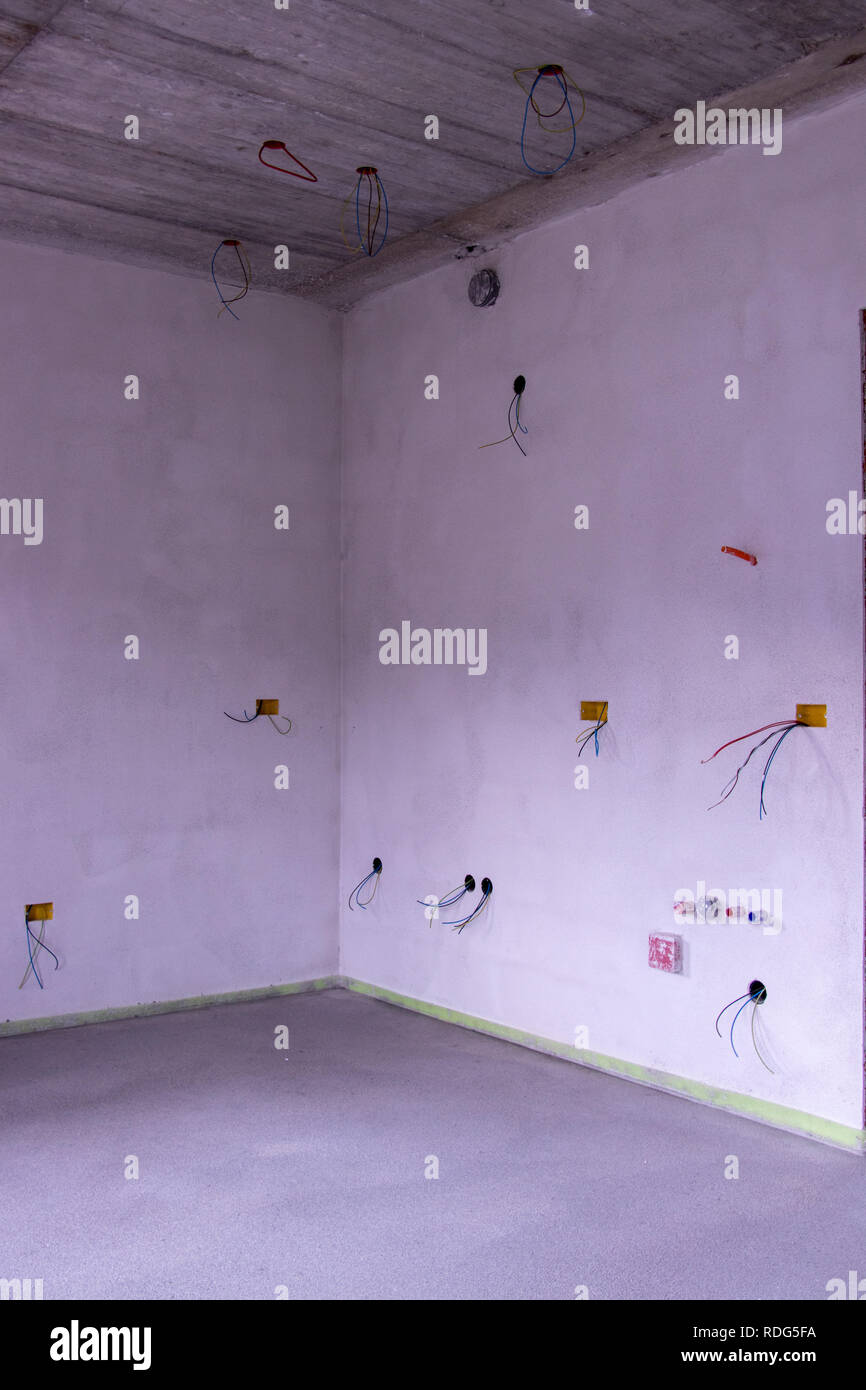 render wall with colorful electric cables Stock Photo - Alamy