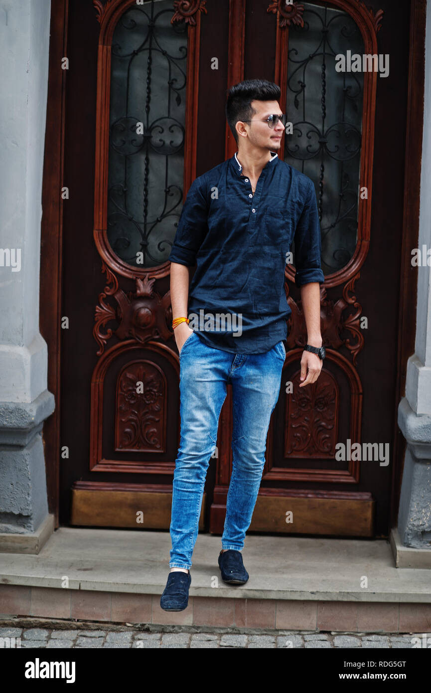Stylish indian model man in casual clothes and sunglasses posed outdoor ...