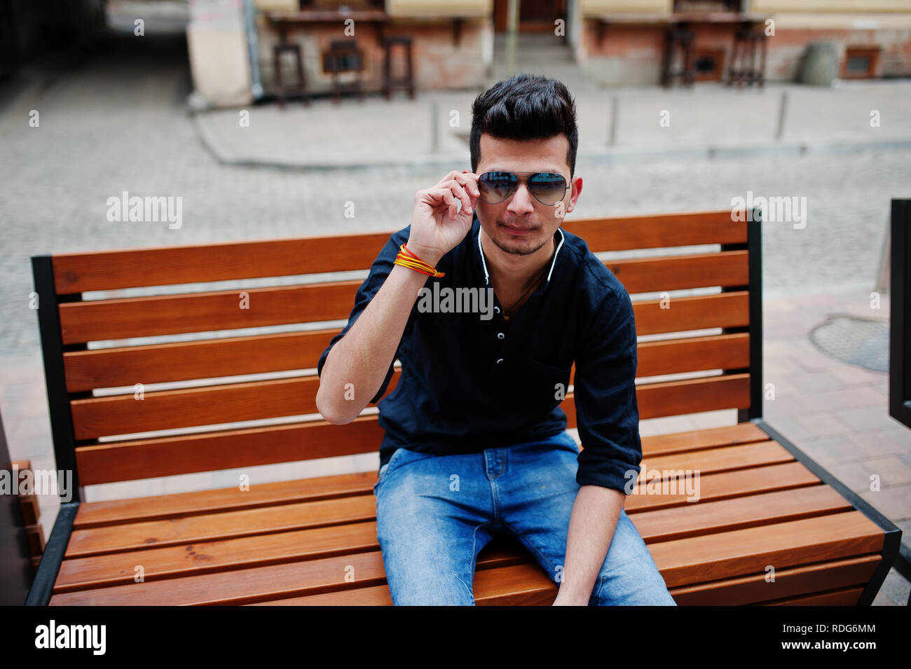 Stylish indian model man in casual clothes, black shirt and sunglasses ... Stylish indian model man in casual clothes, black shirt and sunglasses ...