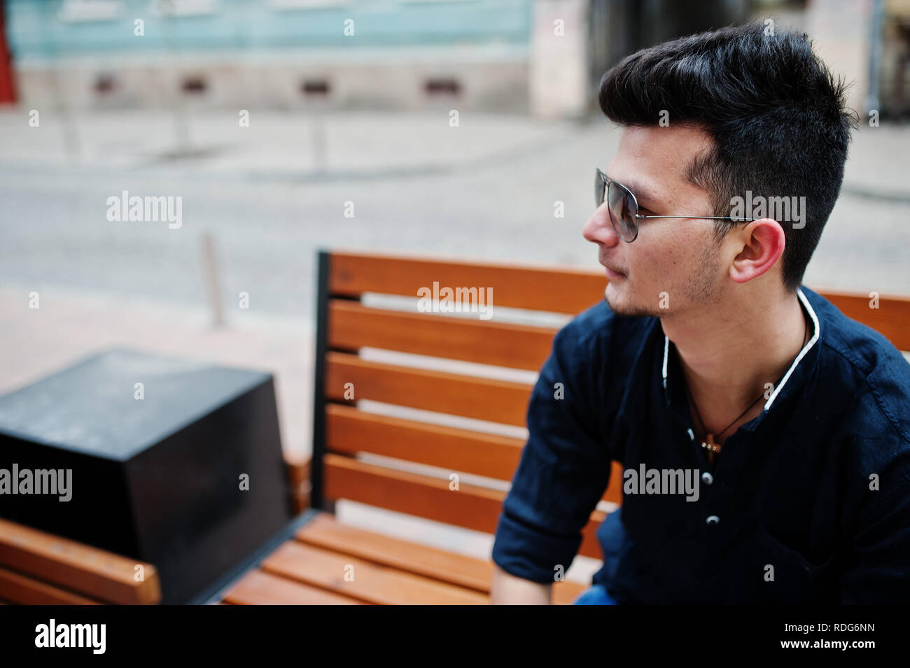 Stylish indian model man in casual clothes, black shirt and sunglasses ...