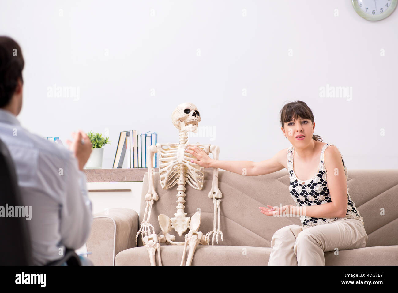 Young patient visiting psychologist for therapy Stock Photo - Alamy