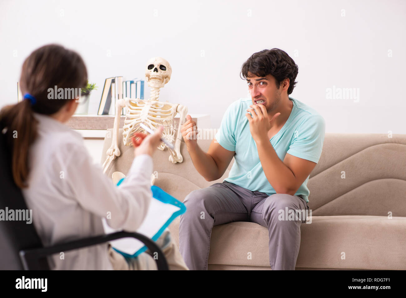 Young patient visiting psychologist for therapy Stock Photo - Alamy