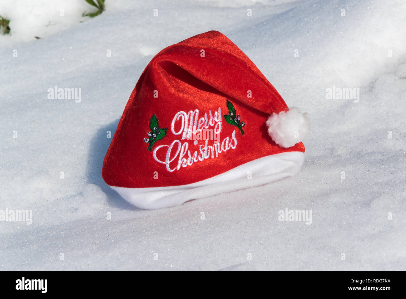 Christmas red hat on the white snow, holiday celebration concept Stock ...