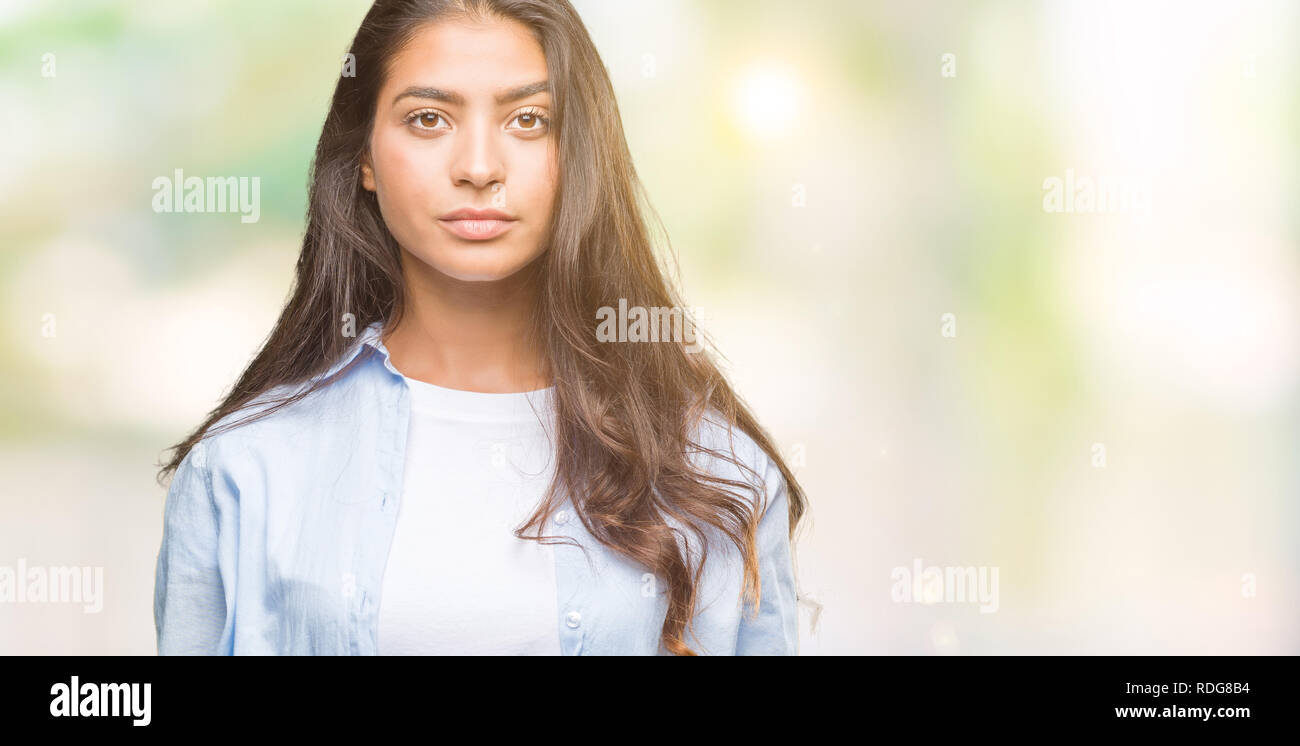 Young beautiful arab woman over isolated background with serious ...