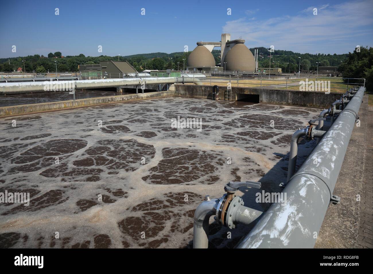 Modern sewage treatment plant, view over a primary clarifier and ...