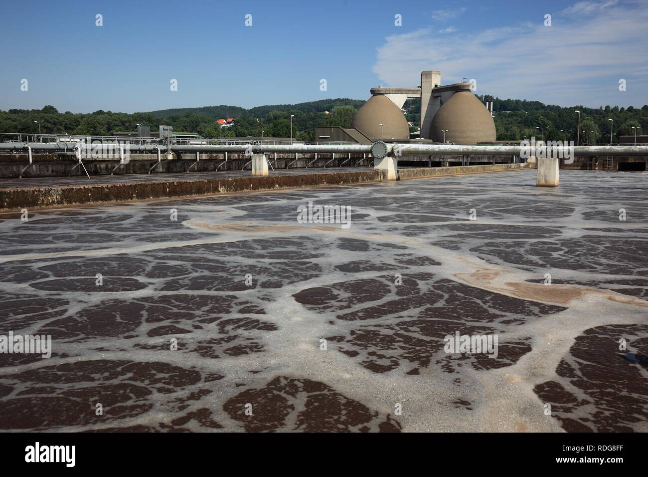 Modern sewage treatment plant, view over a primary clarifier and ...