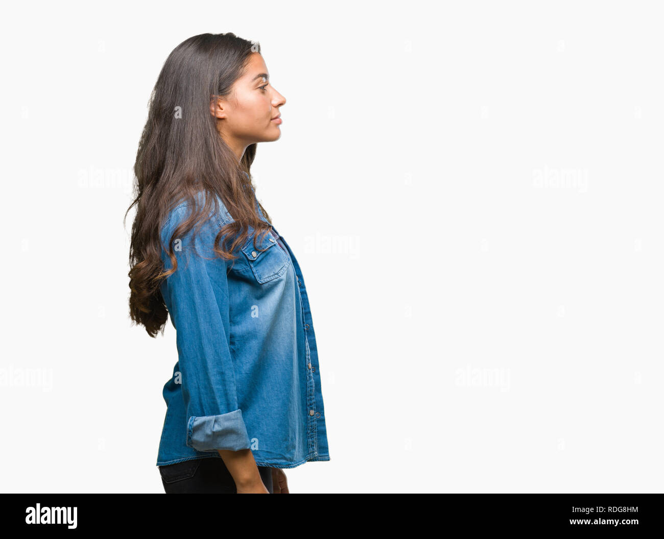 Young beautiful arab woman over isolated background looking to side ...