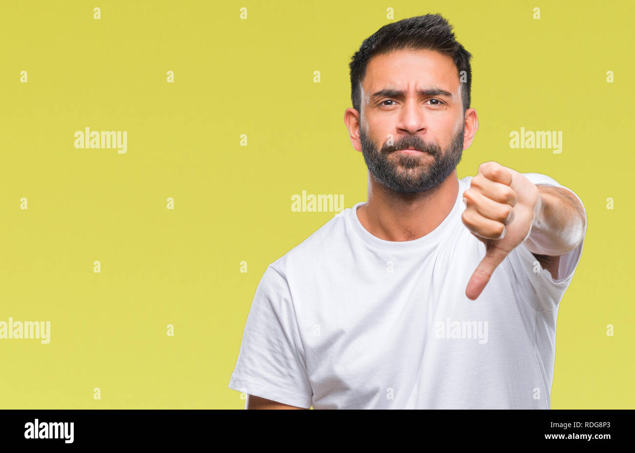 Adult hispanic man over isolated background looking unhappy and angry ...