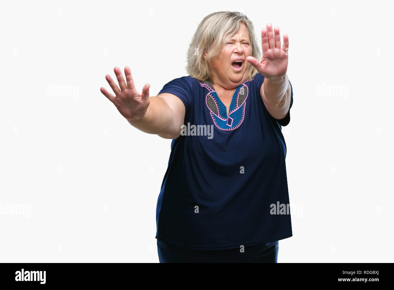 Senior plus size caucasian woman over isolated background afraid and ...
