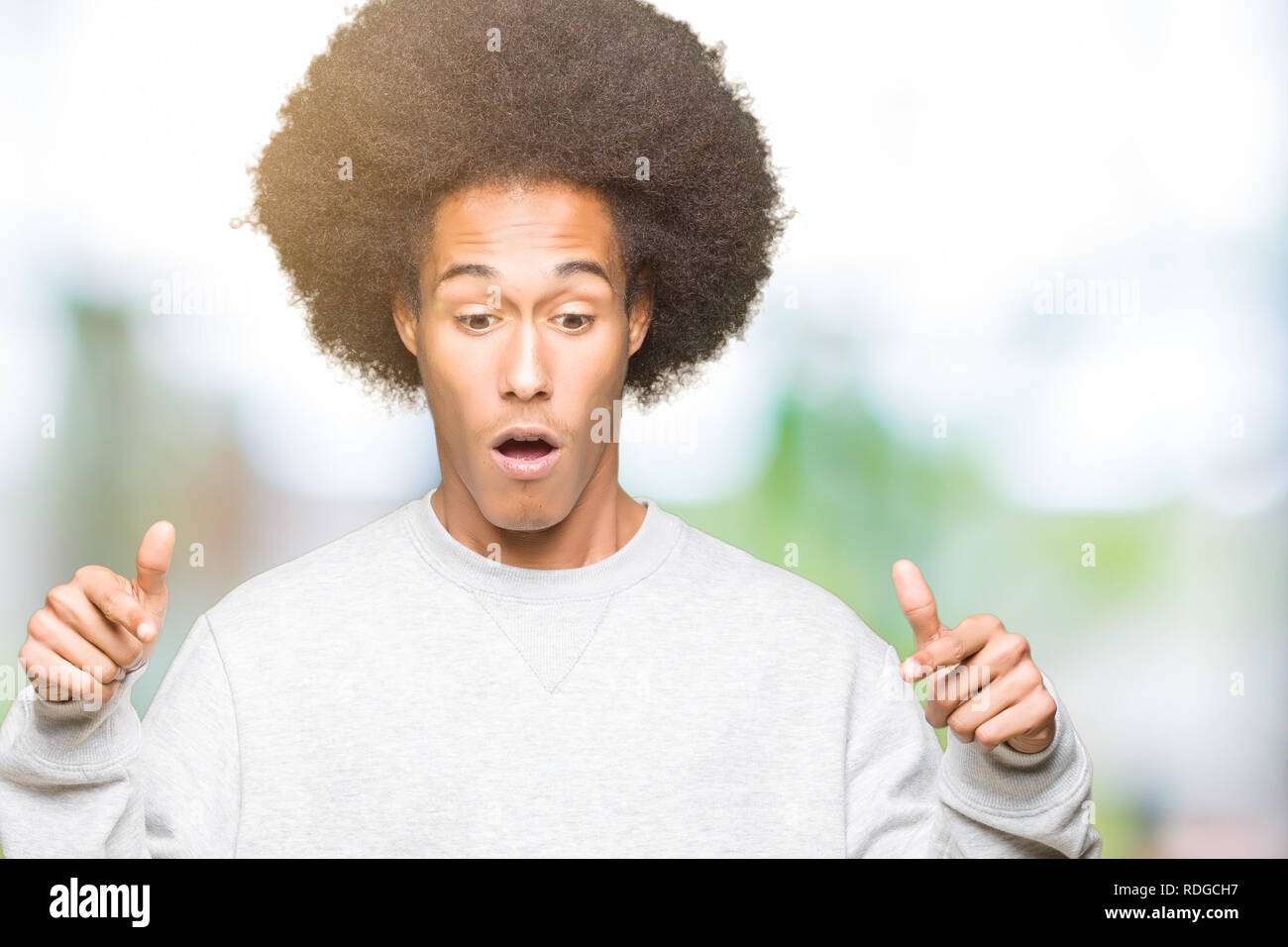 Young african american man with afro hair wearing sporty sweatshirt ...
