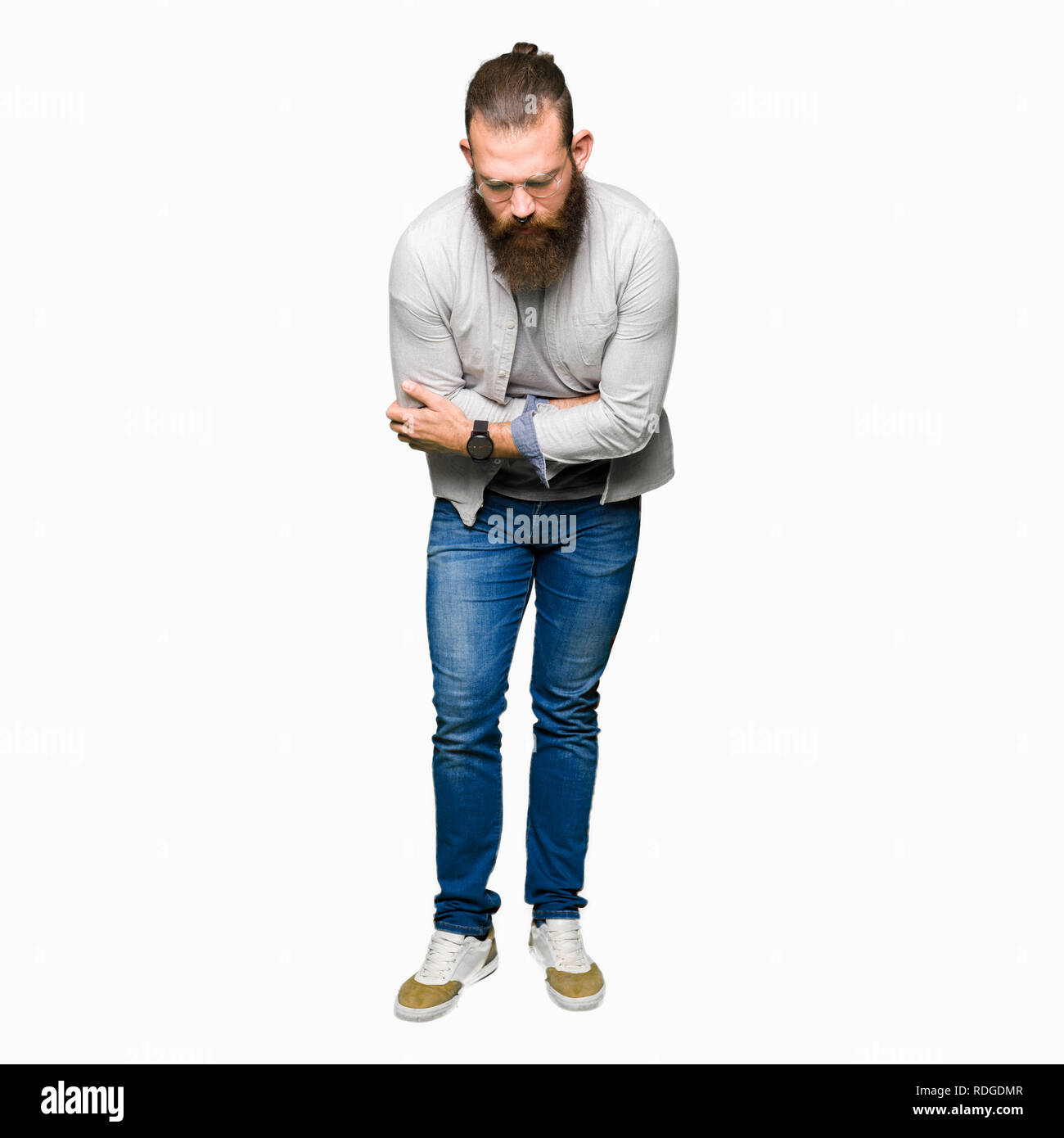 Young blond man wearing glasses with hand on stomach because nausea ...