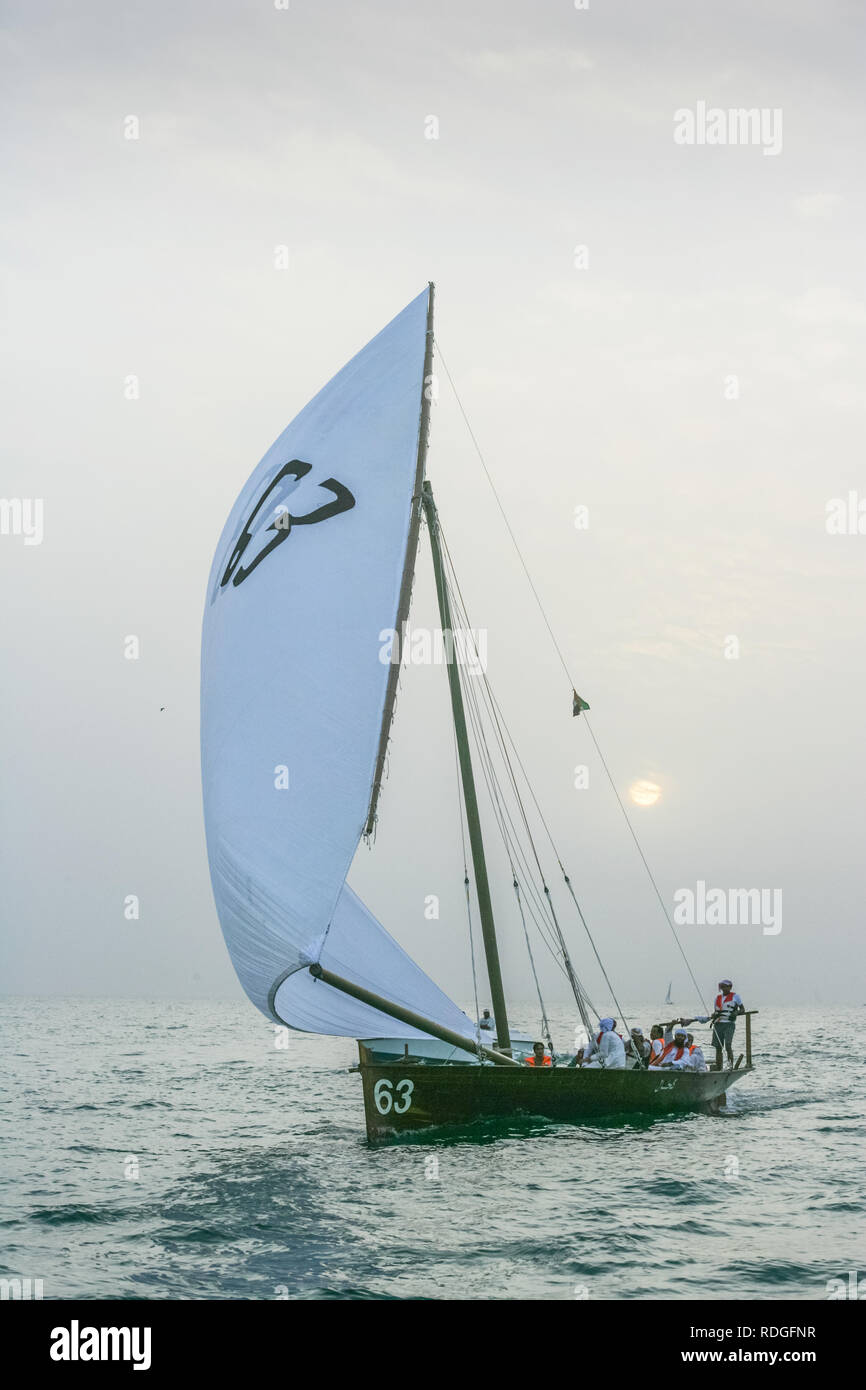 A traditional racing dhow approaching the finishing line off Dubai at ...
