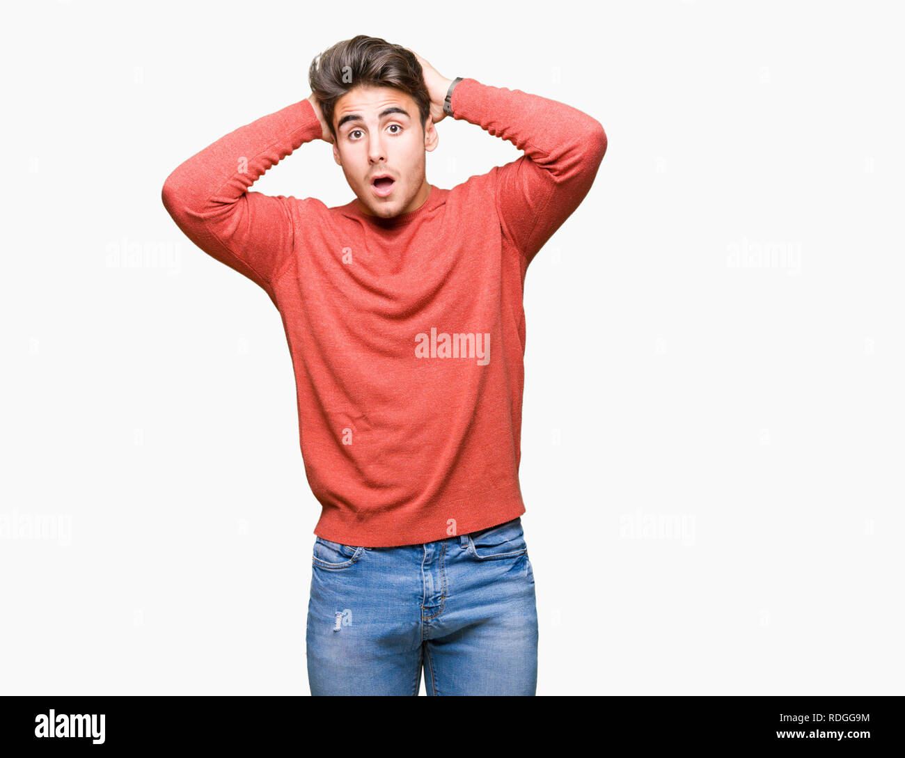 Young handsome man over isolated background Crazy and scared with hands ...