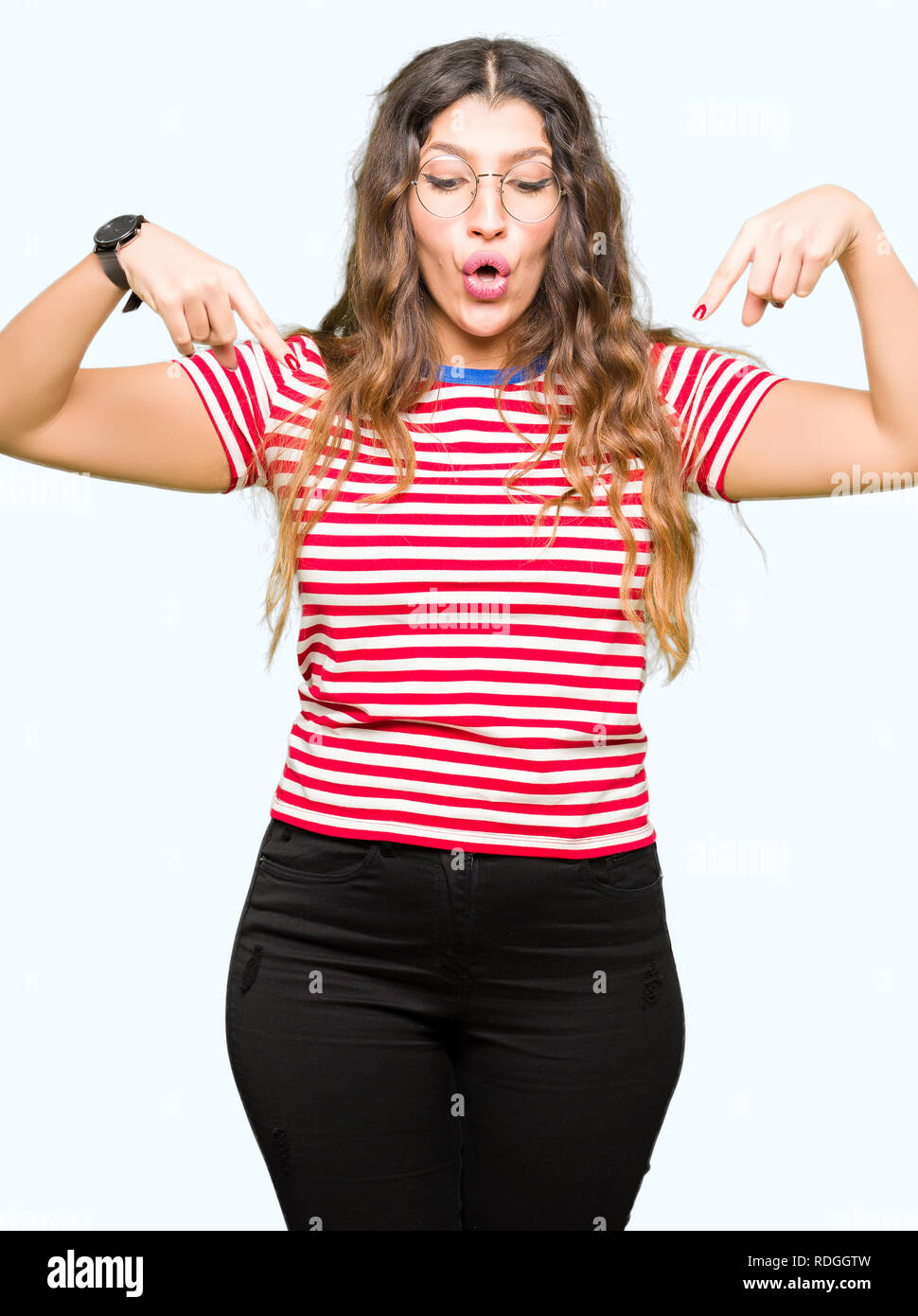 Young beautiful woman wearing glasses Pointing down with fingers ...