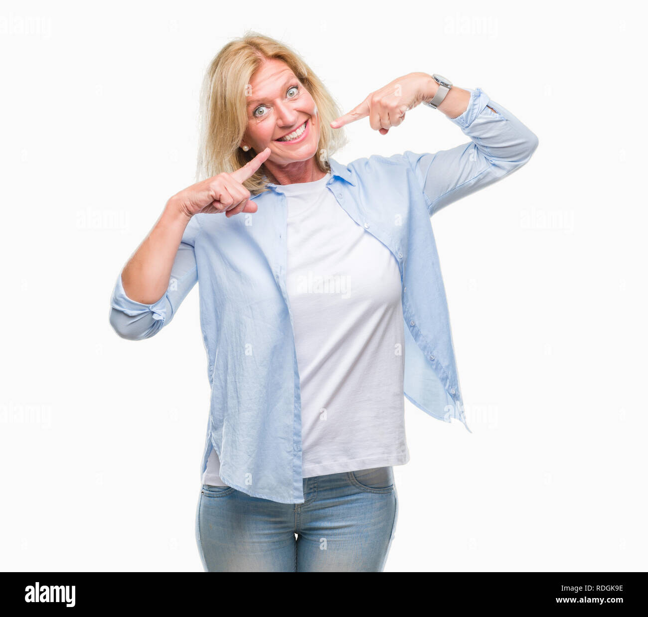 Middle age blonde woman over isolated background smiling confident ...