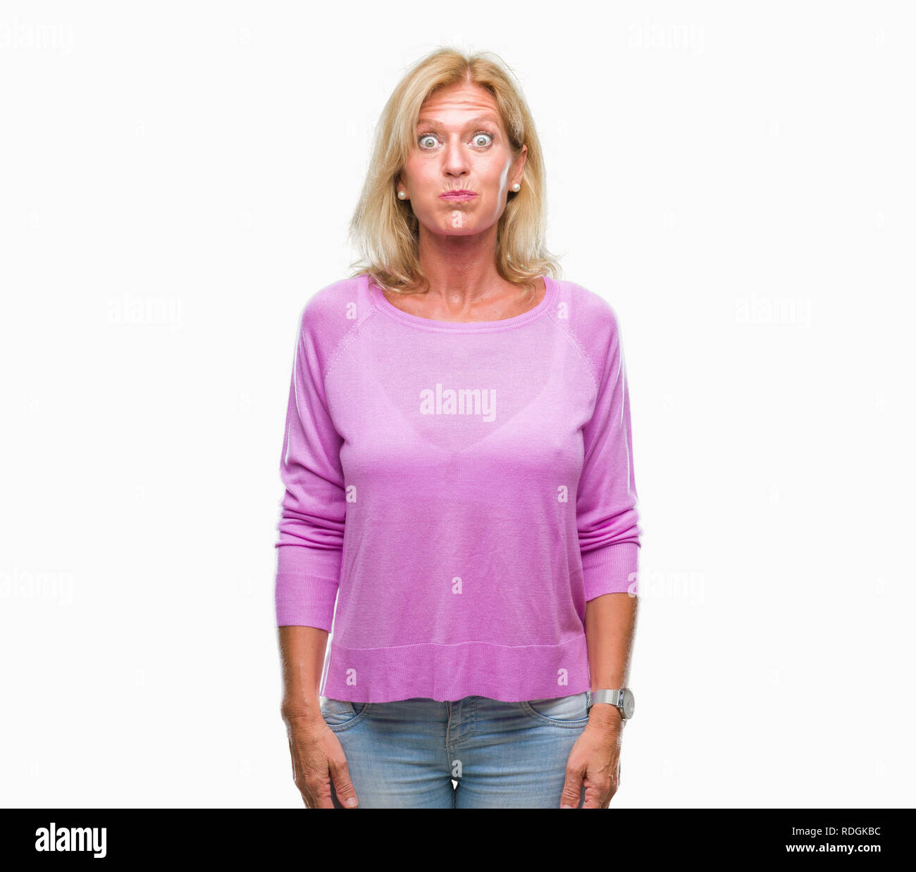 Middle age blonde woman over isolated background puffing cheeks with ...
