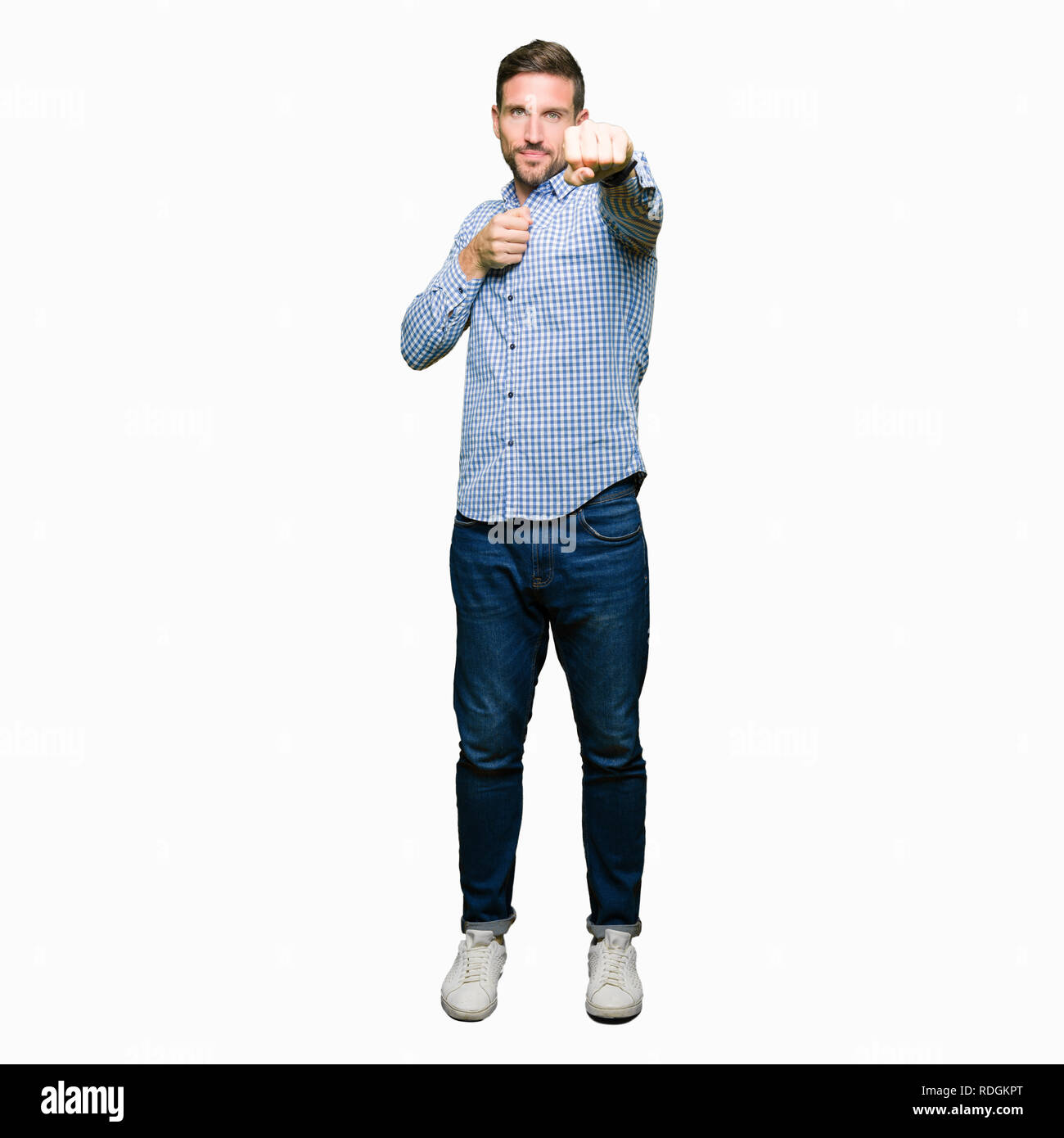 Handsome business man with blue eyes Punching fist to fight, aggressive ...