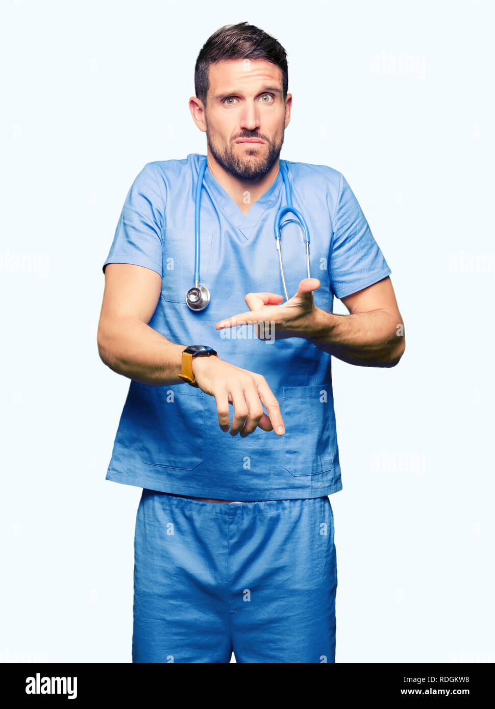 Handsome doctor man wearing medical uniform over isolated background In ...