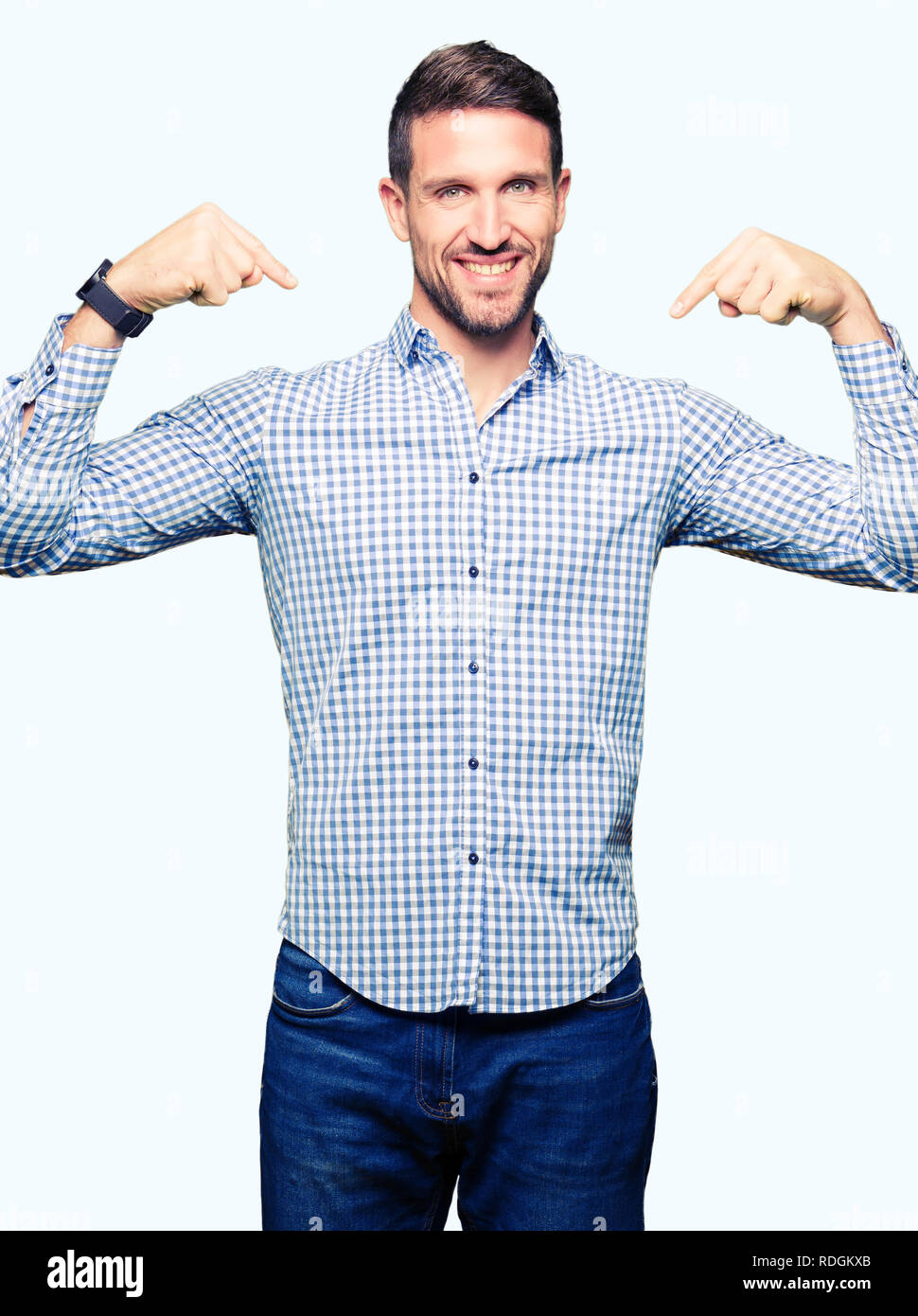 Handsome business man with blue eyes looking confident with smile on ...