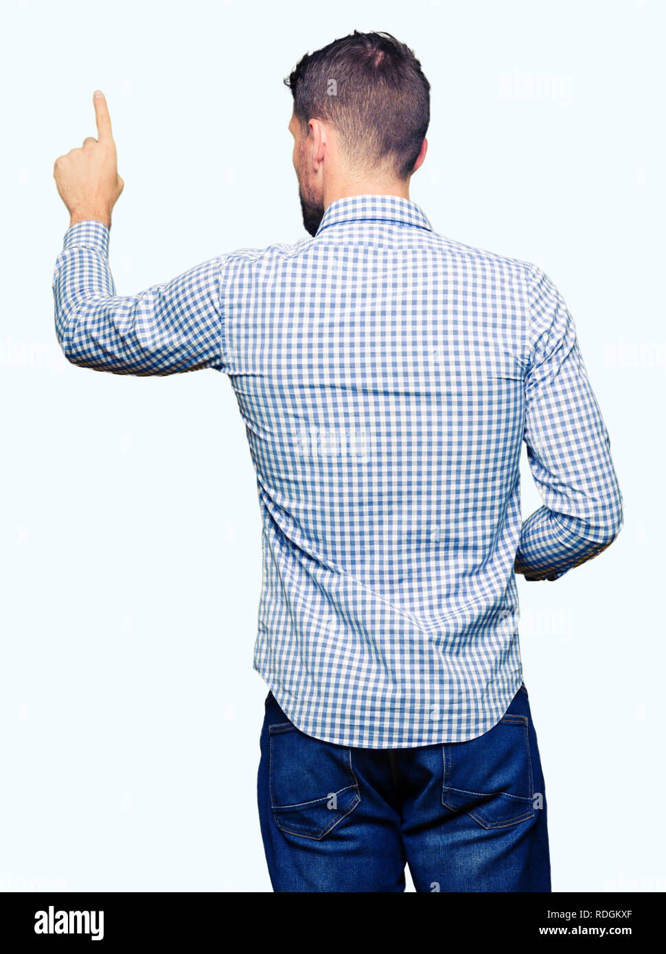Handsome business man with blue eyes Posing backwards pointing behind ...