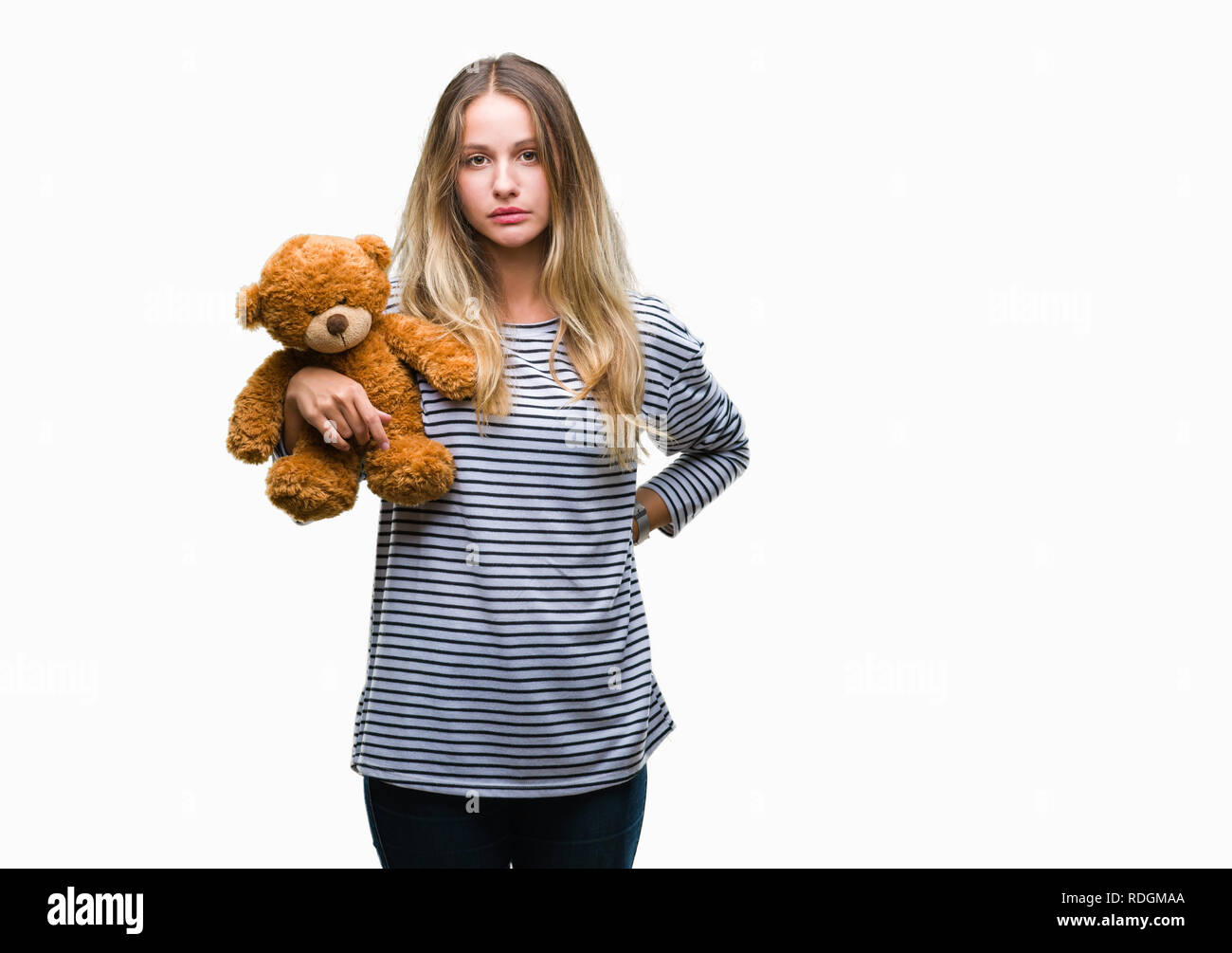 Young beautiful blonde woman holding teddy bear plush over isolated ...