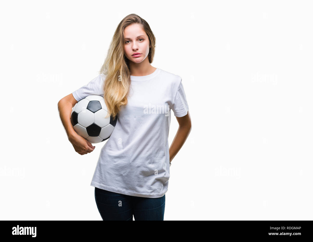 Young beautiful blonde woman holding soccer ball over isolated ...